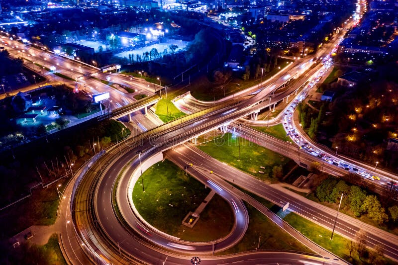 Night Aerial View Panorama of a Freeway Intersection Traffic Trails in ...