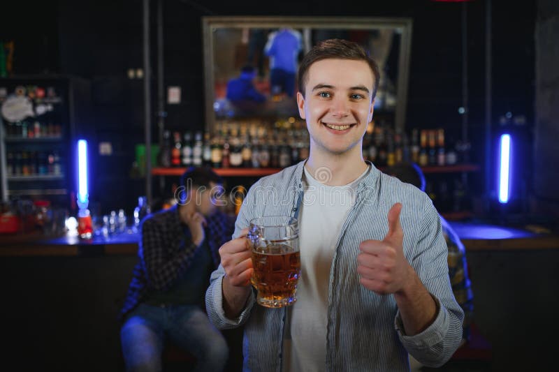 Night in Bar. Portrait of Cheerful Men Drinking Beer at the Bar Stock ...