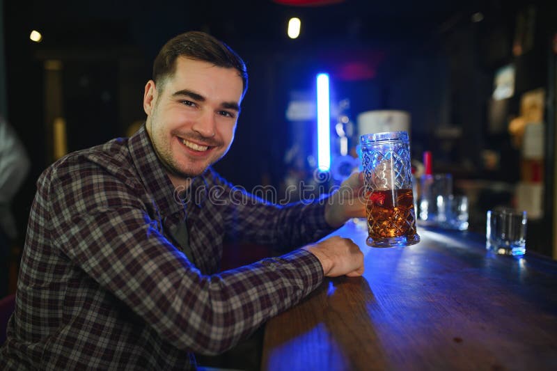 Night in Bar. Portrait of Cheerful Men Drinking Beer at the Bar Stock ... Night in Bar. Portrait of Cheerful Men Drinking Beer at the Bar Stock ...