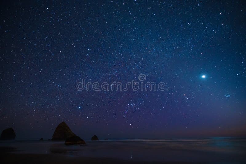 Night Beach of the Sea or Ocean at Sunset. Rocks in the Water. Night ...