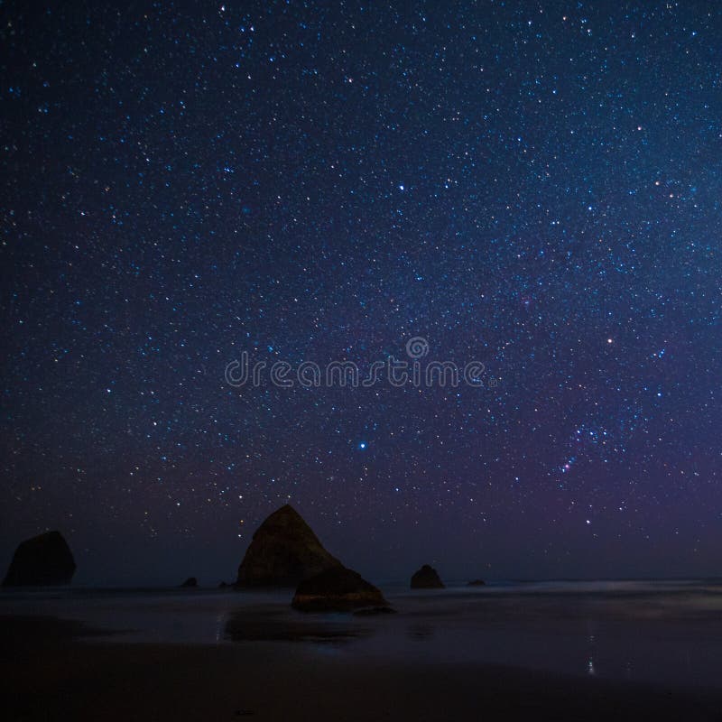 Night Beach of the Sea or Ocean at Sunset. Rocks in the Water Stock ...