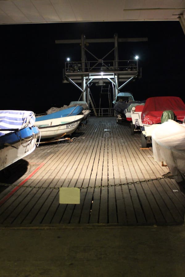 Night Boat Dock in the Boathouse Editorial Stock Image - Image of rays ...