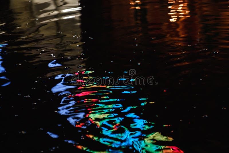 Puddle on Asphalt Road with Stormwater on the Side of the Road. Stock ...