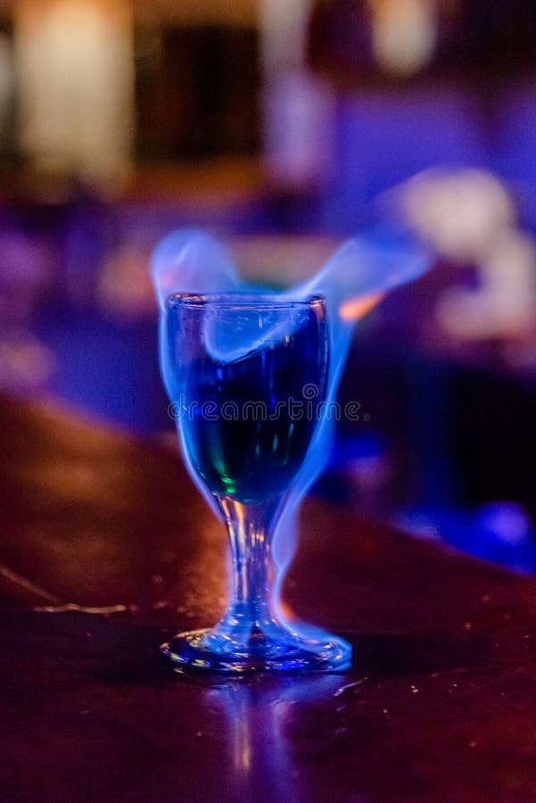 Night Cocktail Burning with Fire at the Bar Table Stock Photo - Image ...