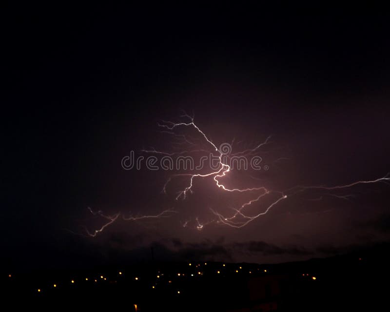 Night Dark Sky with a Bright Lightning Strike Over a City Stock Image ...