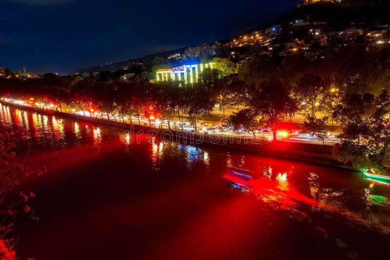 The Night Embankment Near the River in the Perspective of Illumination ...