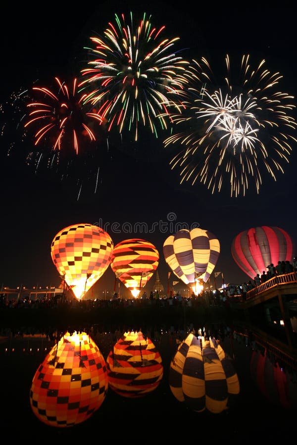 Night Glow Hot Air Balloon with Beautiful Firework Stock Image - Image ...