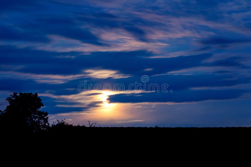 Bright Moon on Fall Night with Clouds and Foliage Stock Photo - Image ...