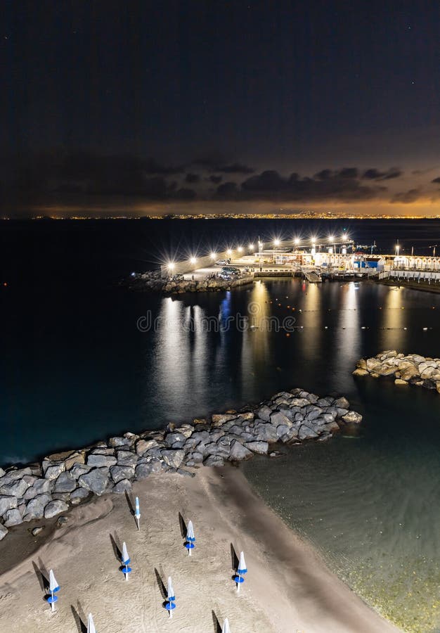 Night Landscape of Coast with Small Beach and Breakwater with Pier ...