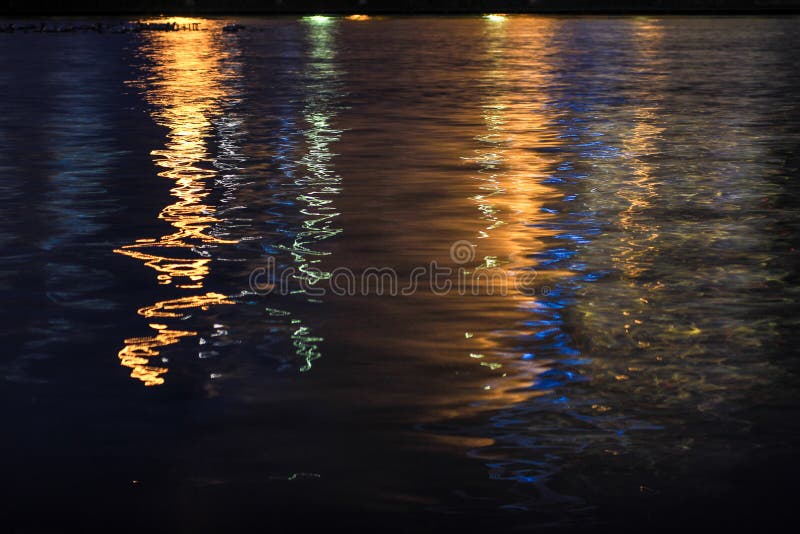 Night Landscape, Sea, Colored Lights Reflected in Stock Image - Image ...
