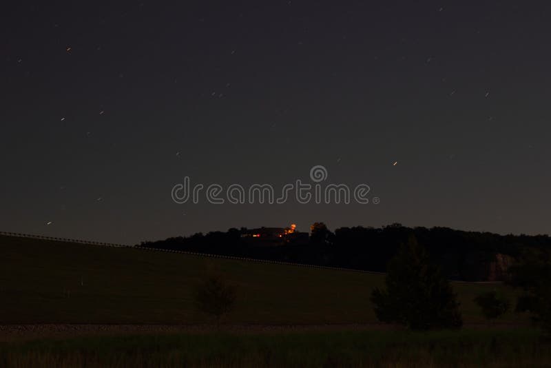 Night Landscape with a Starry Sky and a Fire Far Away Stock Photo ...