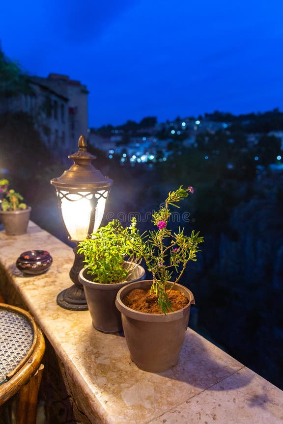 Night Lantern and Flower Pots on Stone Parapet Stock Photo - Image of ...