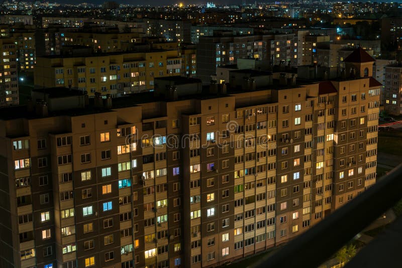 Night Panorama of Light in the Windows of a Multistory Building. Life ...