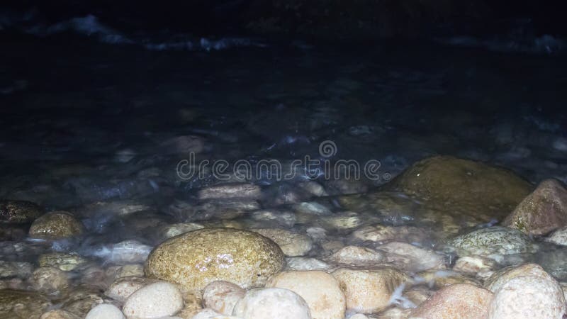 Night Pebble Beach and Roll Stock Photo - Image of spotlight, landscape ...