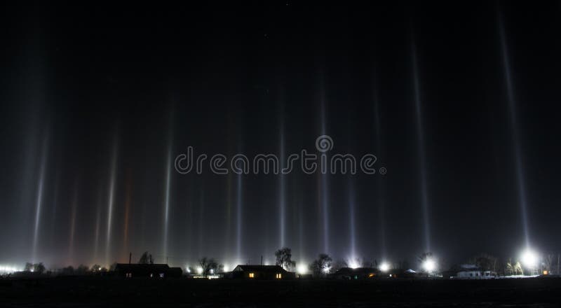 Night Photo of the Village, Light Rays from Searchlights in the Cold ...