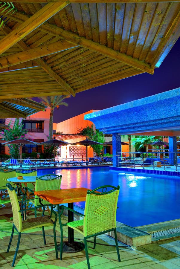 Night pool and cafe table stock photo. Image of beauty - 11991414