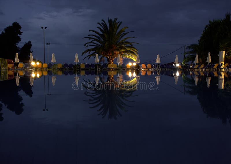 Night Pool with Reflection of a Stormy Sky Stock Photo - Image of palm ...