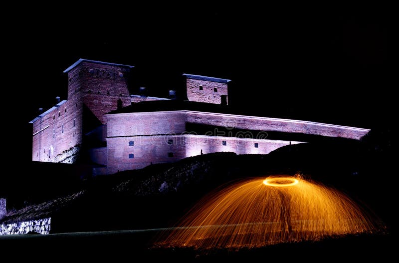 A Night Scene of a Medieval Castle with a Spinning Steel Wool Firework ...