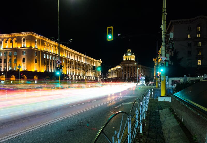 Night Scene of Tram in Traffic at Crossing with Lighttrail Motion Blur ...