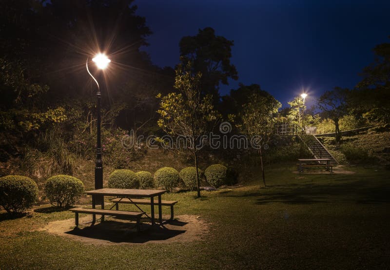 Night Scenery of Bench, Picnic Table and Street Light in Park Stock ...