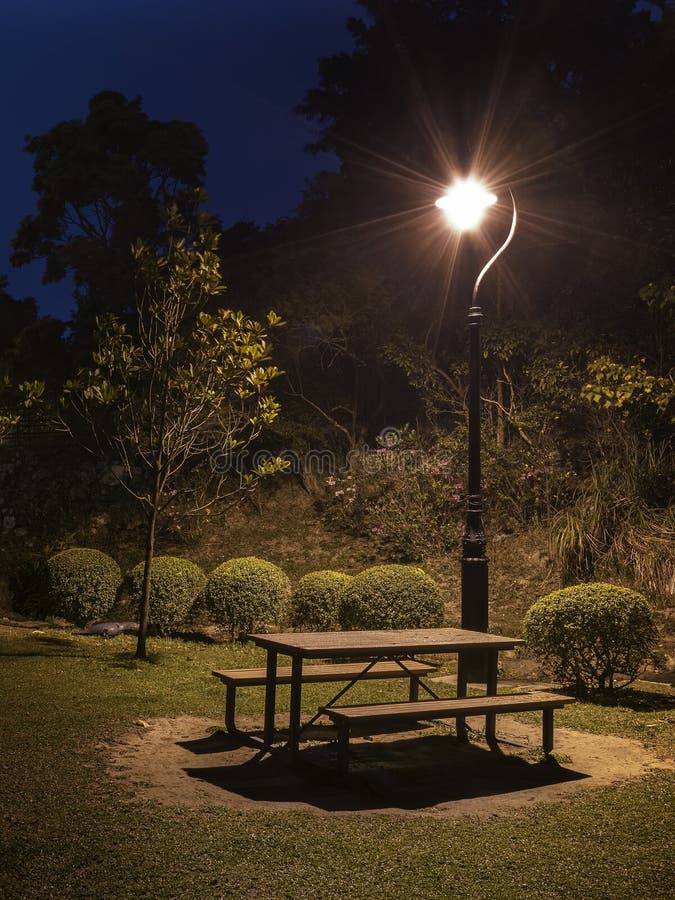 Night Scenery of Bench, Picnic Table and Street Light in Park Stock ...
