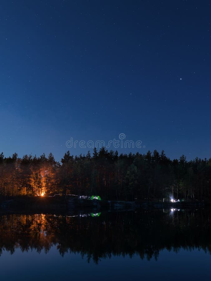 Night Scenery of a Forest Lake with Tents and a Campfire Stock Photo ...