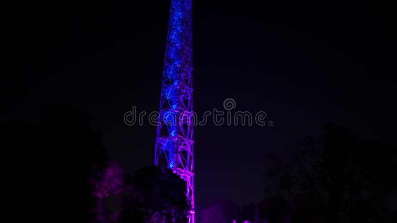 Night Scenes - Tower Illuminated with Multicolored Neon Stock Footage ...