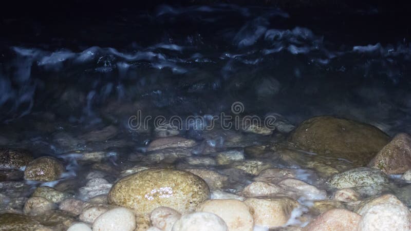 Night Pebble Beach and Roll Stock Image - Image of aqua, navy: 169615345