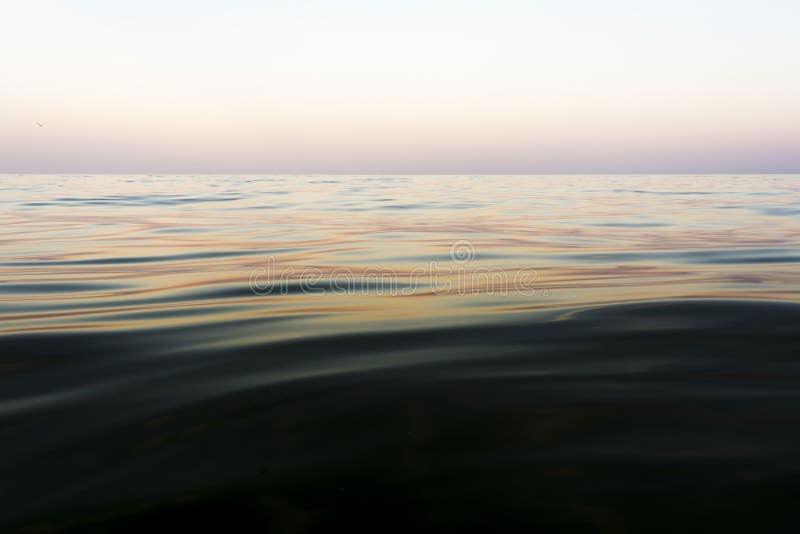 Evening Sea with Waves, Far Away on a Horizon Line Floating Ship ...