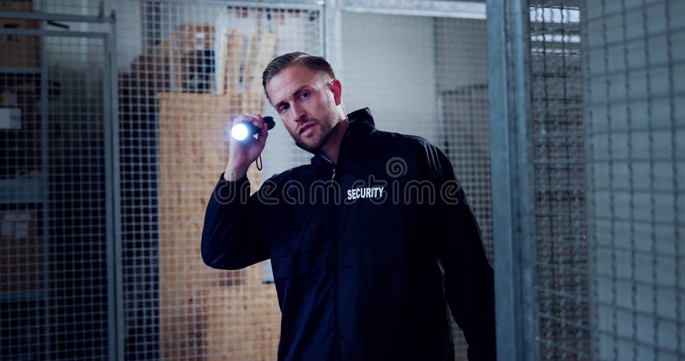 Night Security Officer Shining Flashlight Guarding Warehouse Stock ...