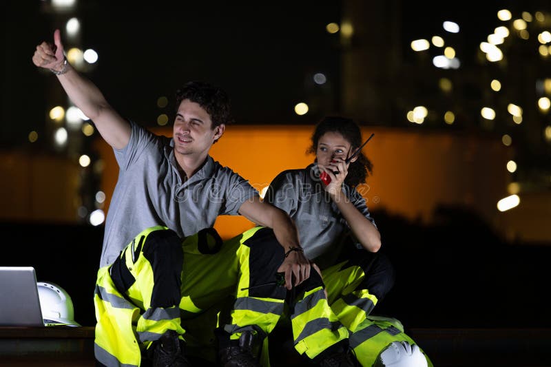 Night Shift Engineers Communicating on Site, Industrial Workers at ...