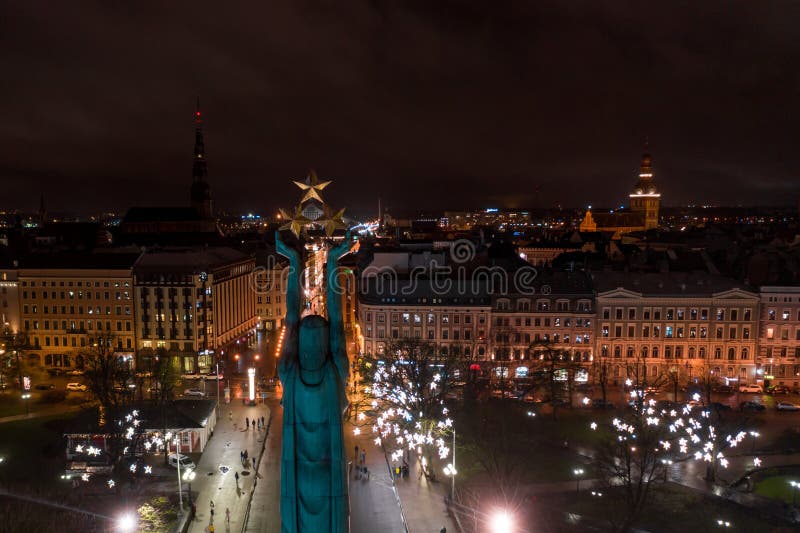 Night Shot of the Top of Freedom Monument on Background of Riga, Latvia ...