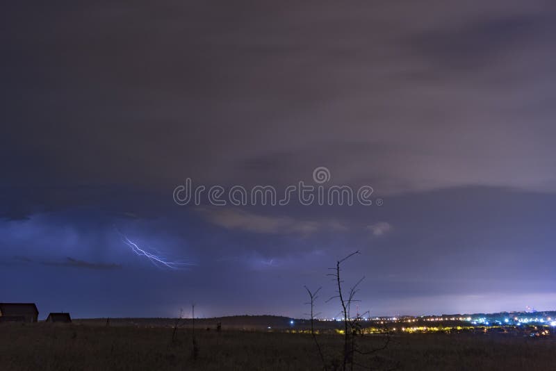Night Sky with Clouds and Lightning Over a Small Town Stock Image ...