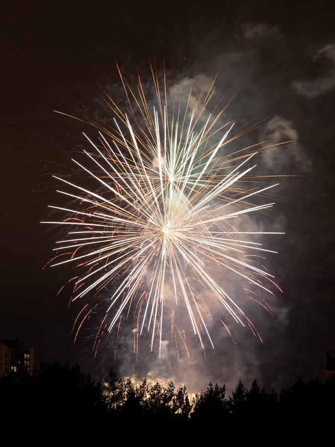 Vibrant Fireworks Light Up the Night Sky Over a City Skyline Stock ...