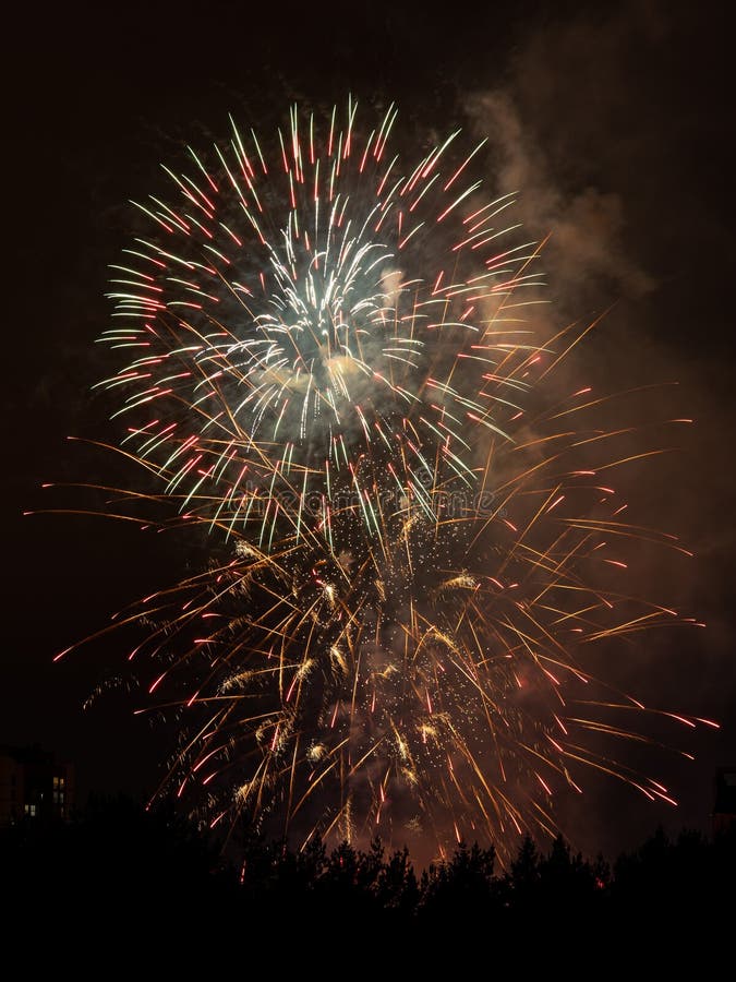 Vibrant Fireworks Light Up the Night Sky Over a City Skyline Stock ...