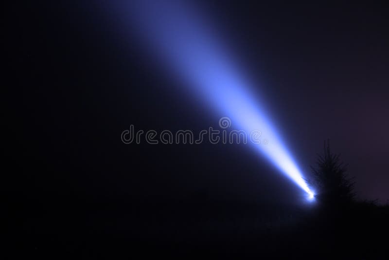 Night Sky Lit by Bright Beam of Flashlight in Forest Stock Image ...