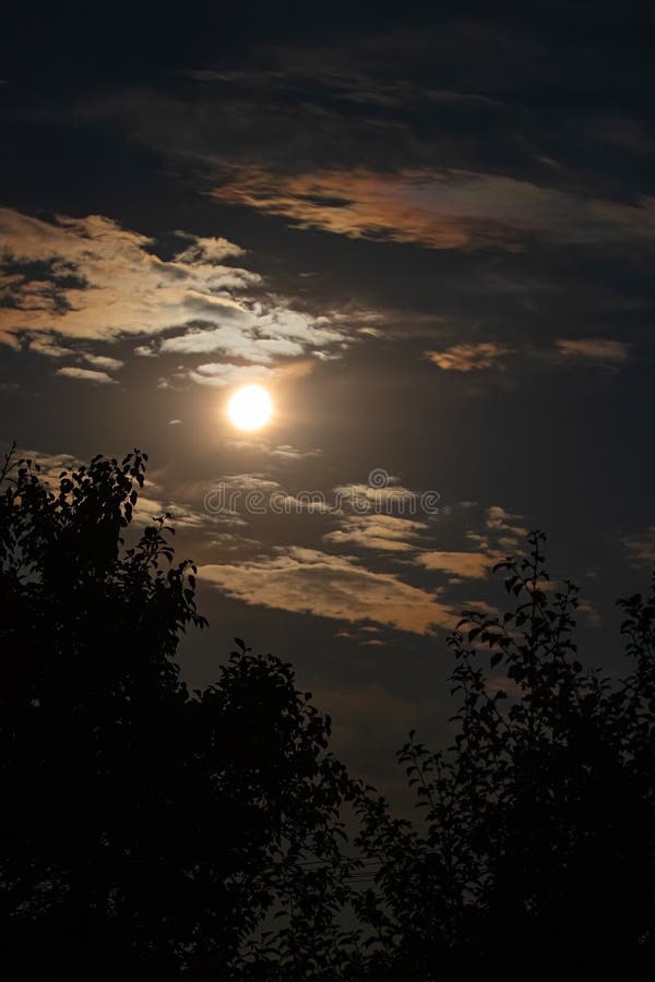 Night Skyscape with Clouds Illuminated by Moonlight. Bright Moon in the ...