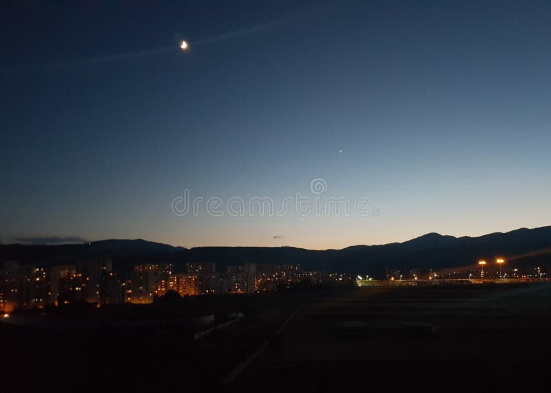 Almost night stock image. Image of mountains, city, moon - 122246419