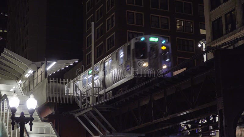 Night Time Exterior of Loop Train Passing through Elevated Station ...