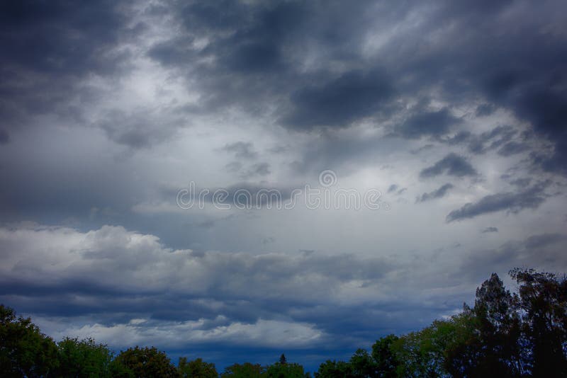 Menacing Sky with Clouds and Sun Emerging through Translucent Clouds ...