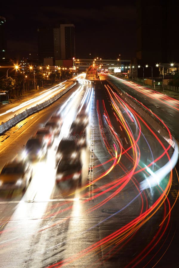 Busy road at night stock photo. Image of traffic, tree - 21985100