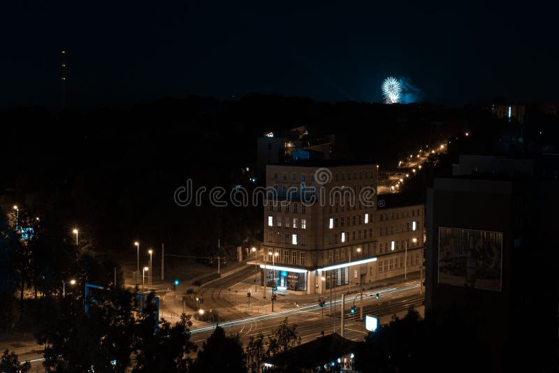 Night View of a Building in a City with Fireworks in the Background ...