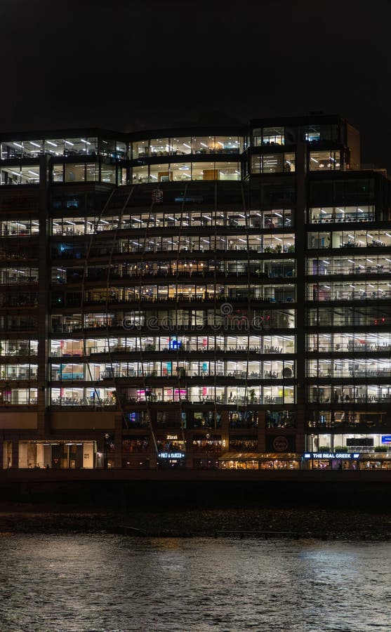 Night View of the Facade of Riverside House and Its Restaurants at ...