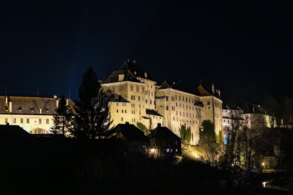 Night View of Historic Castle with Illuminated Facade and Tree ...