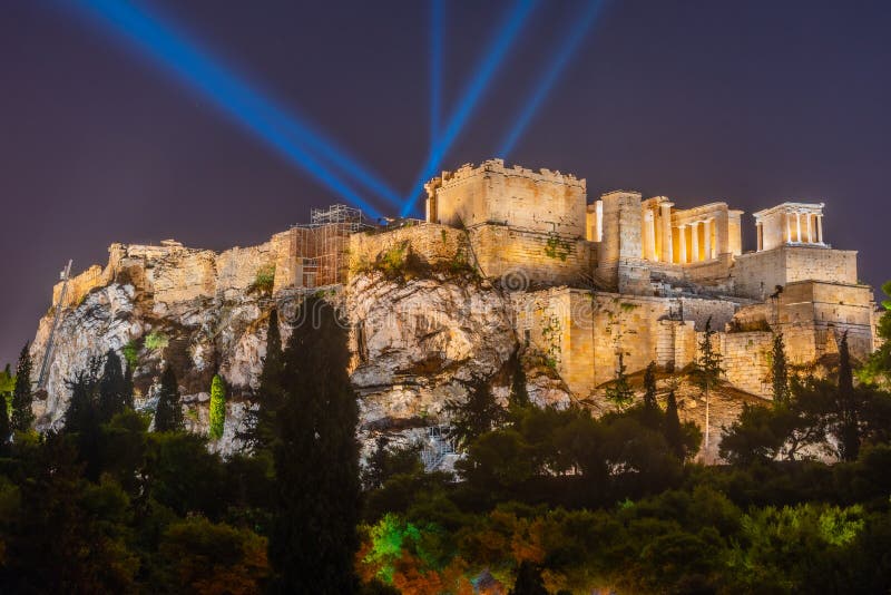 Night View of Illuminated Akropolis with Light Beams Directed into the ...