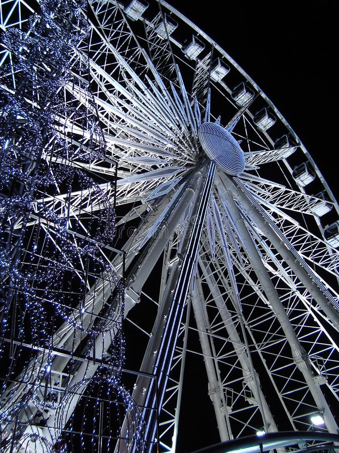 Night View of the Illuminated Ferris Wheel on Place De La Concorde in ...