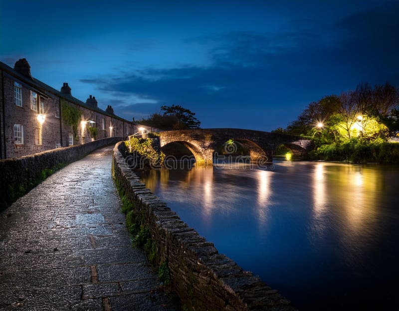 Night View of an Illuminated Irish Bridge and River Path, Inviting ...