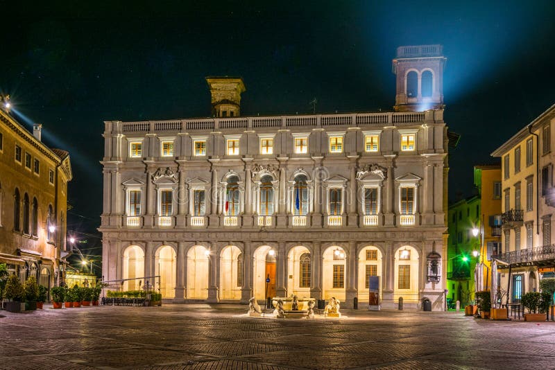 Night View of the Illuminated Public Library in Bergamo, Italy...IMAGE ...