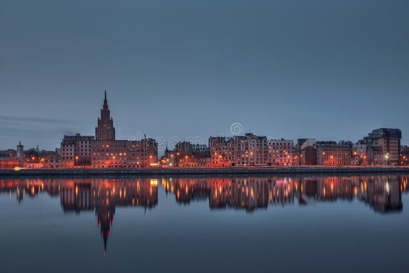 Night View on the Illuminated Riverside with Reflection on the River in ...