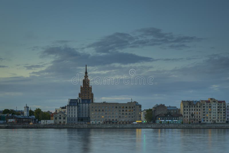 Night View on the Illuminated Riverside with Reflection on the River in ...